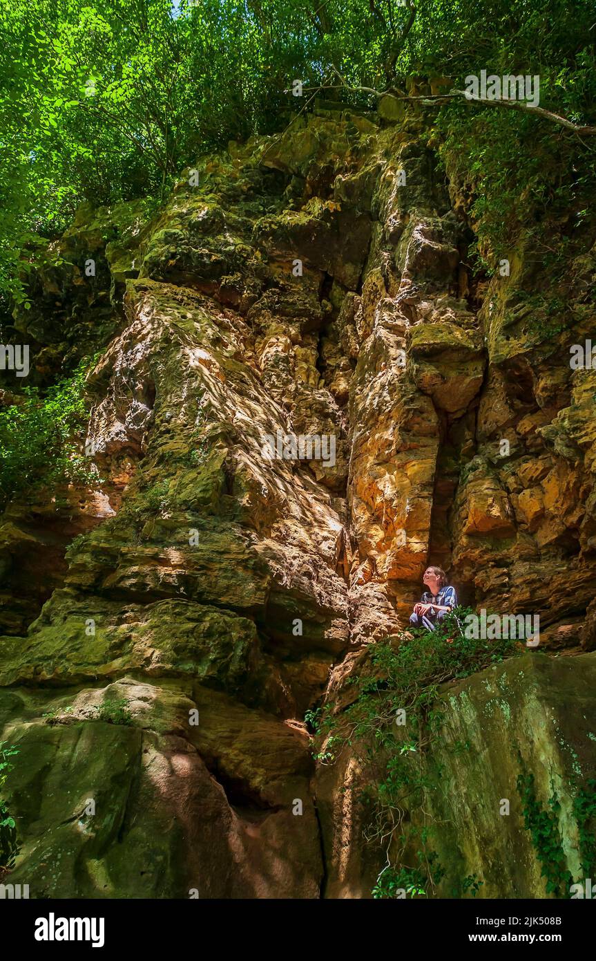 Dominika Wroblewska beneath a dolomite cliff on top of a bed of ...