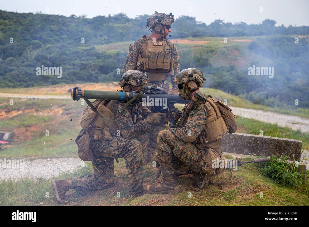 U.S. Marines with 3d Battalion, 2d Marines fire an M136 AT4 rocket ...