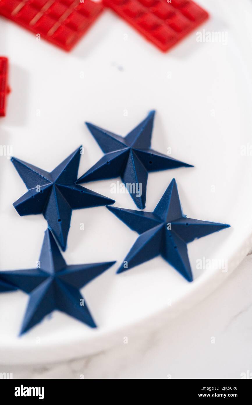 Patriotic blue chocolate star and red mini chocolate Stock Photo - Alamy