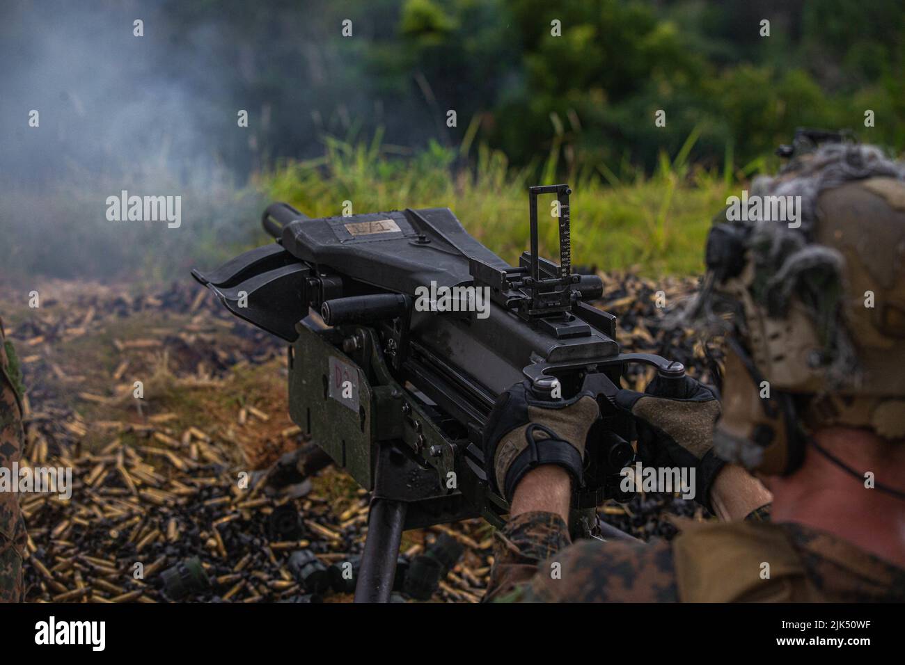 A U.S. Marine with 3d Battalion, 2d Marines fires an MK19 grenade ...