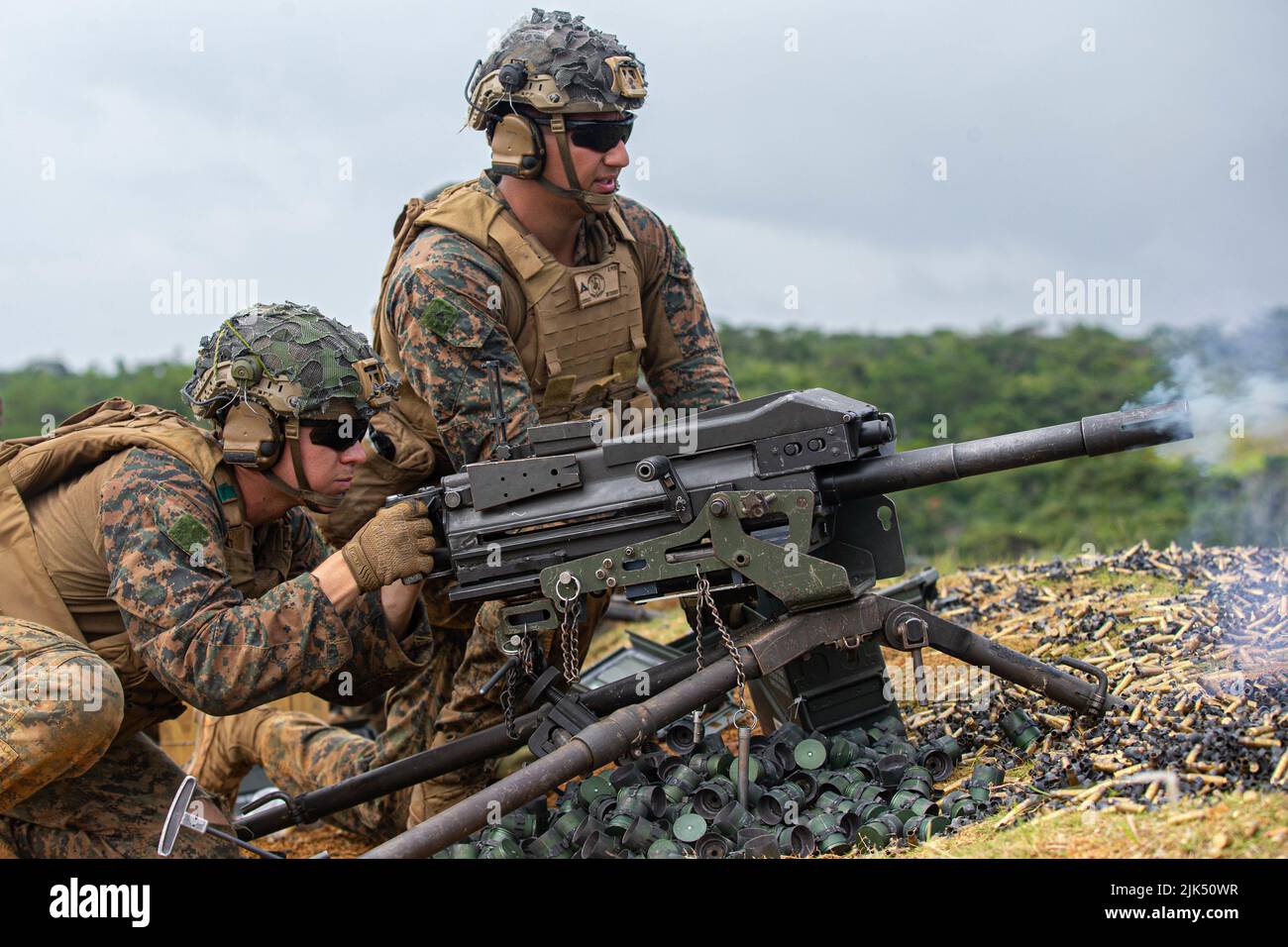 U.S. Marines with 3d Battalion, 2d Marines fire an MK19 grenade ...