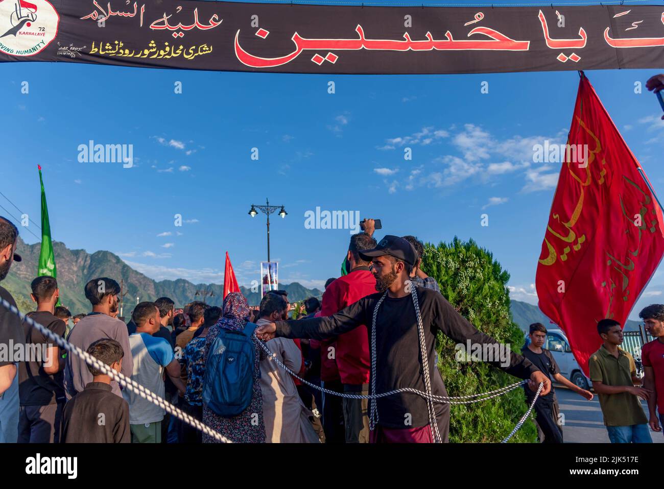 Srinagar, India. 30th July, 2022. Kashmiri Shia Muslims hoisting ...