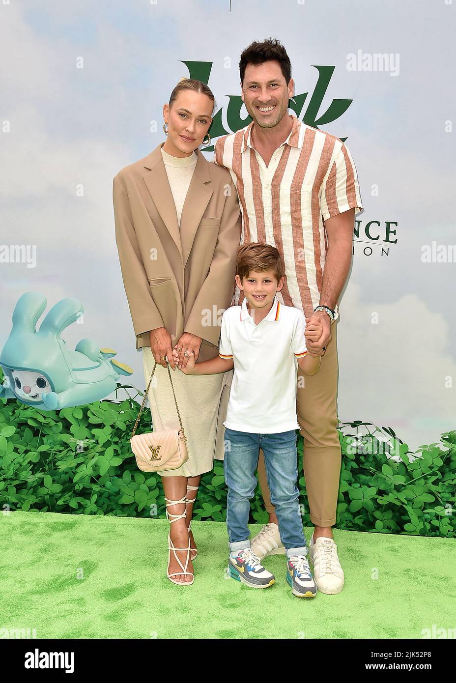 Peta Murgatroyd,Maksim Chmerkovskiy and son Shai walking on the red ...
