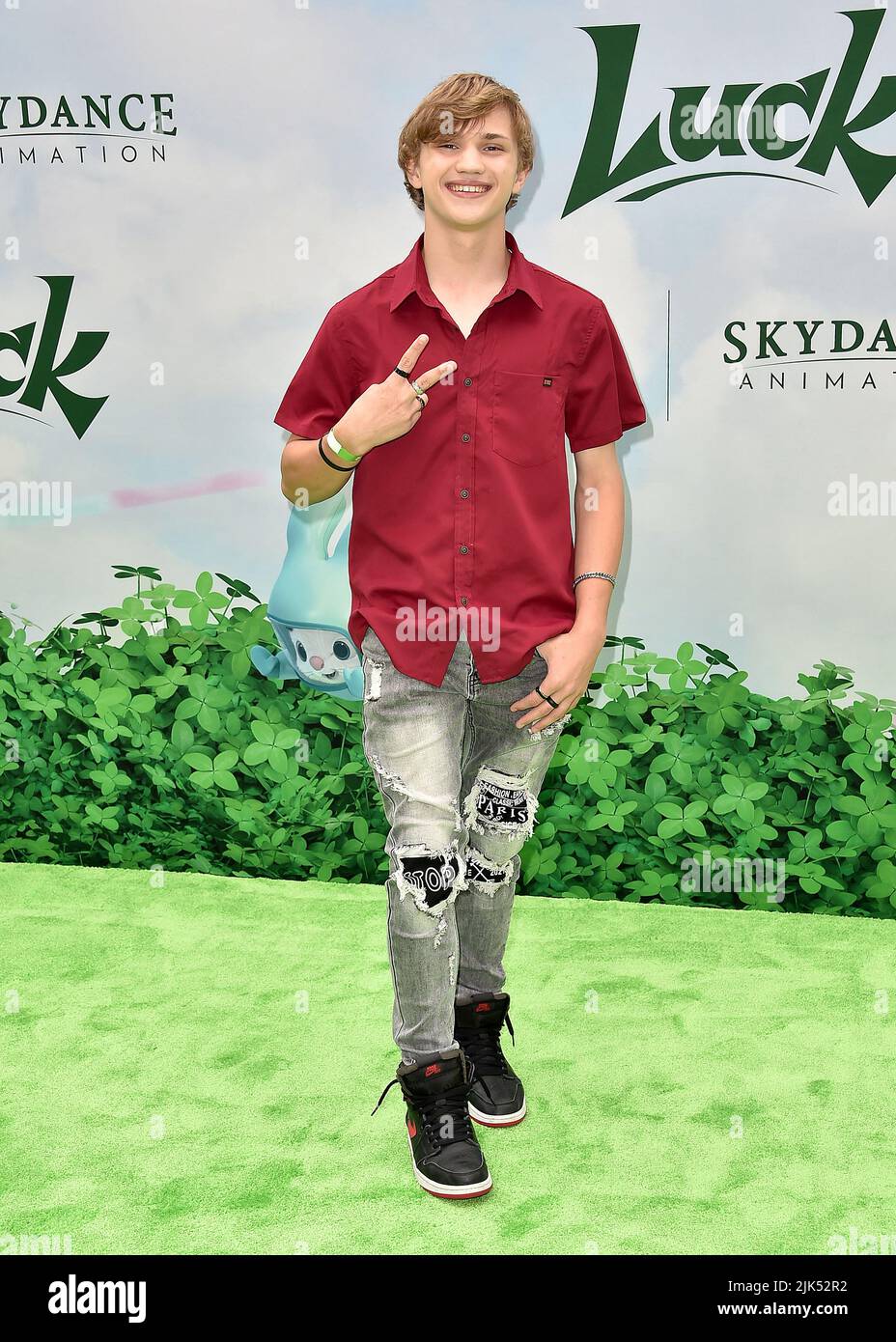 Mason McNulty walking on the red carpet at the global premiere of the ...