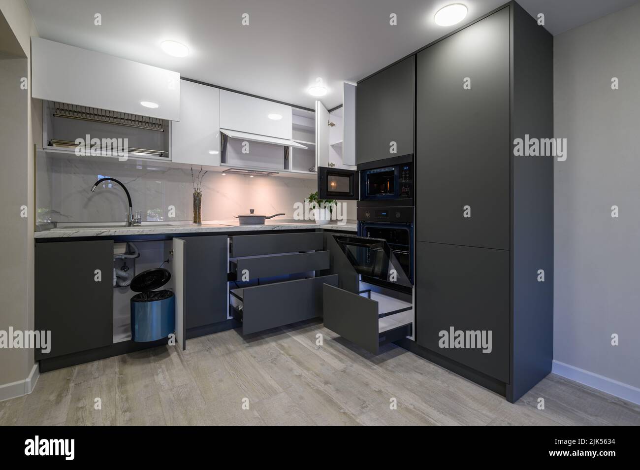 Modern simple trendy dark grey and white kitchen Stock Photo - Alamy