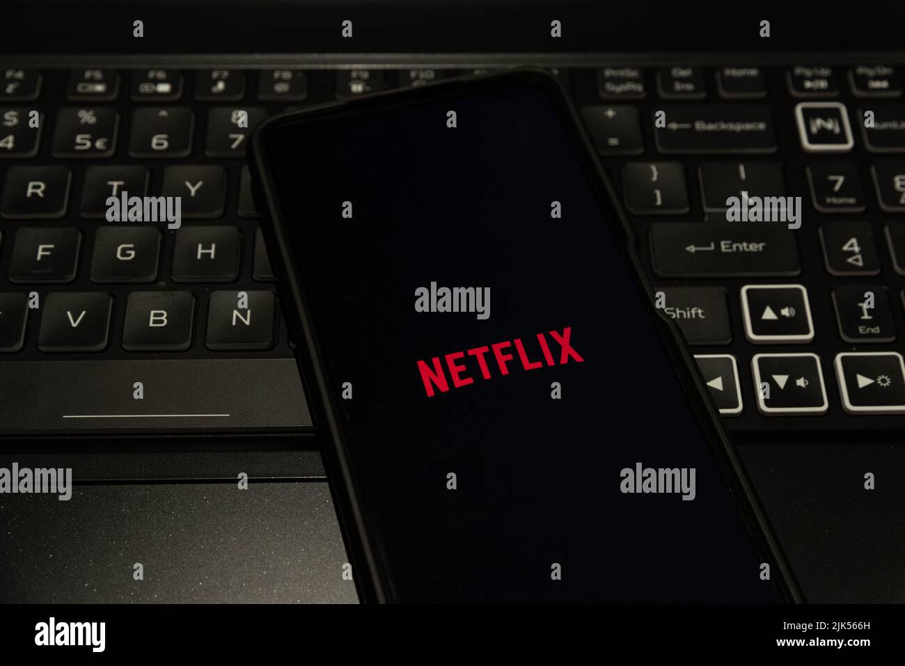 Netflix logo on mobile phone , background is a keyboard , Sydney ...