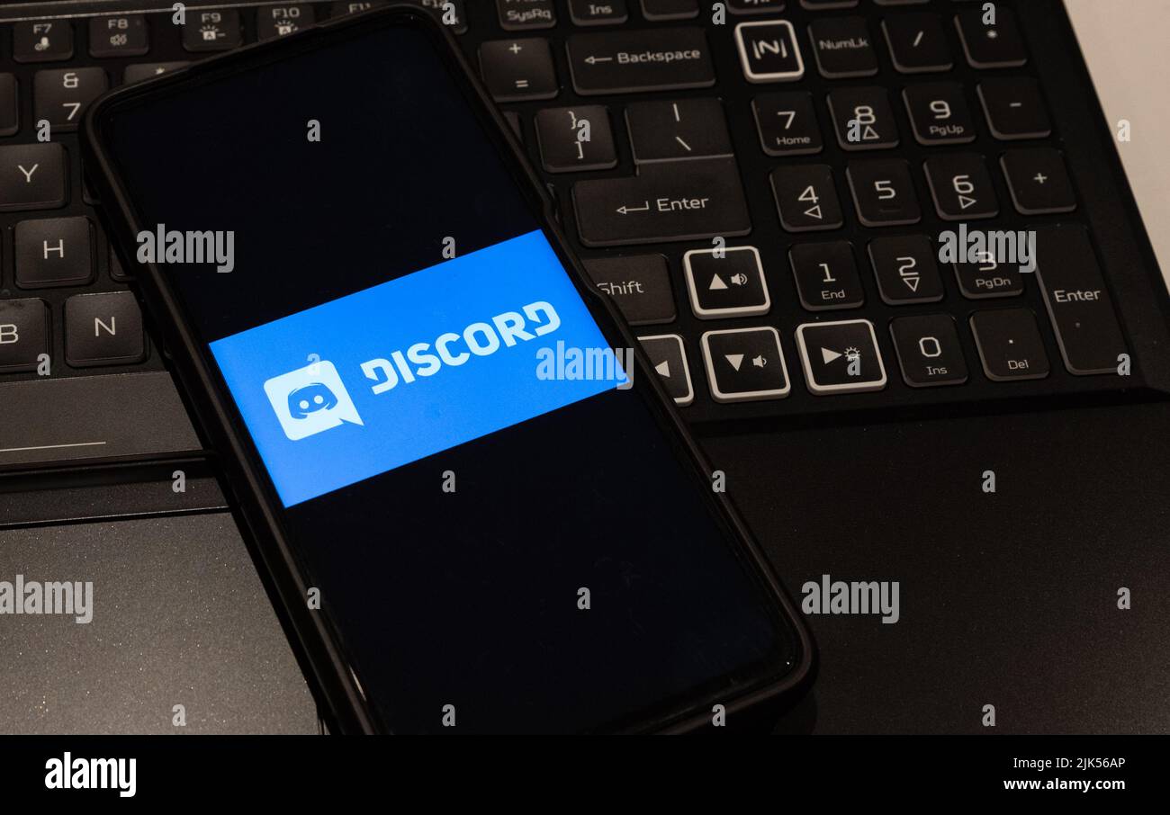 discord logo on mobile phone , background is a keyboard , Sydney ...