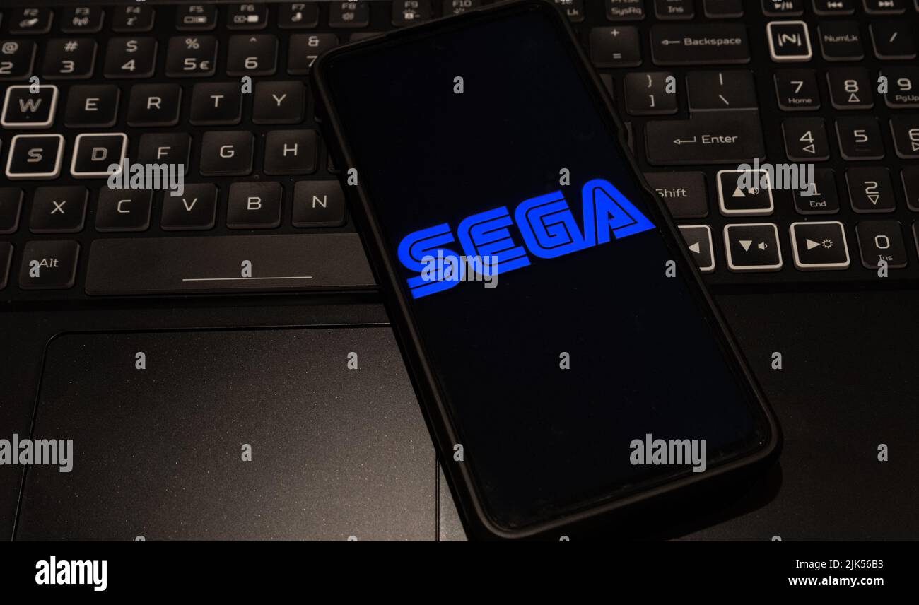 sega logo on mobile phone , background is a keyboard , Sydney Australia ...