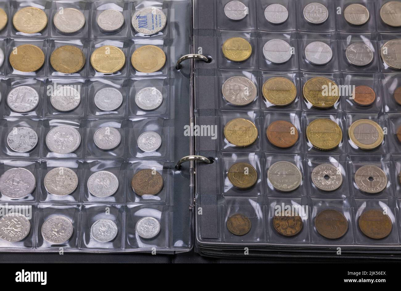 Close up view of album with collectible old coins from different ...