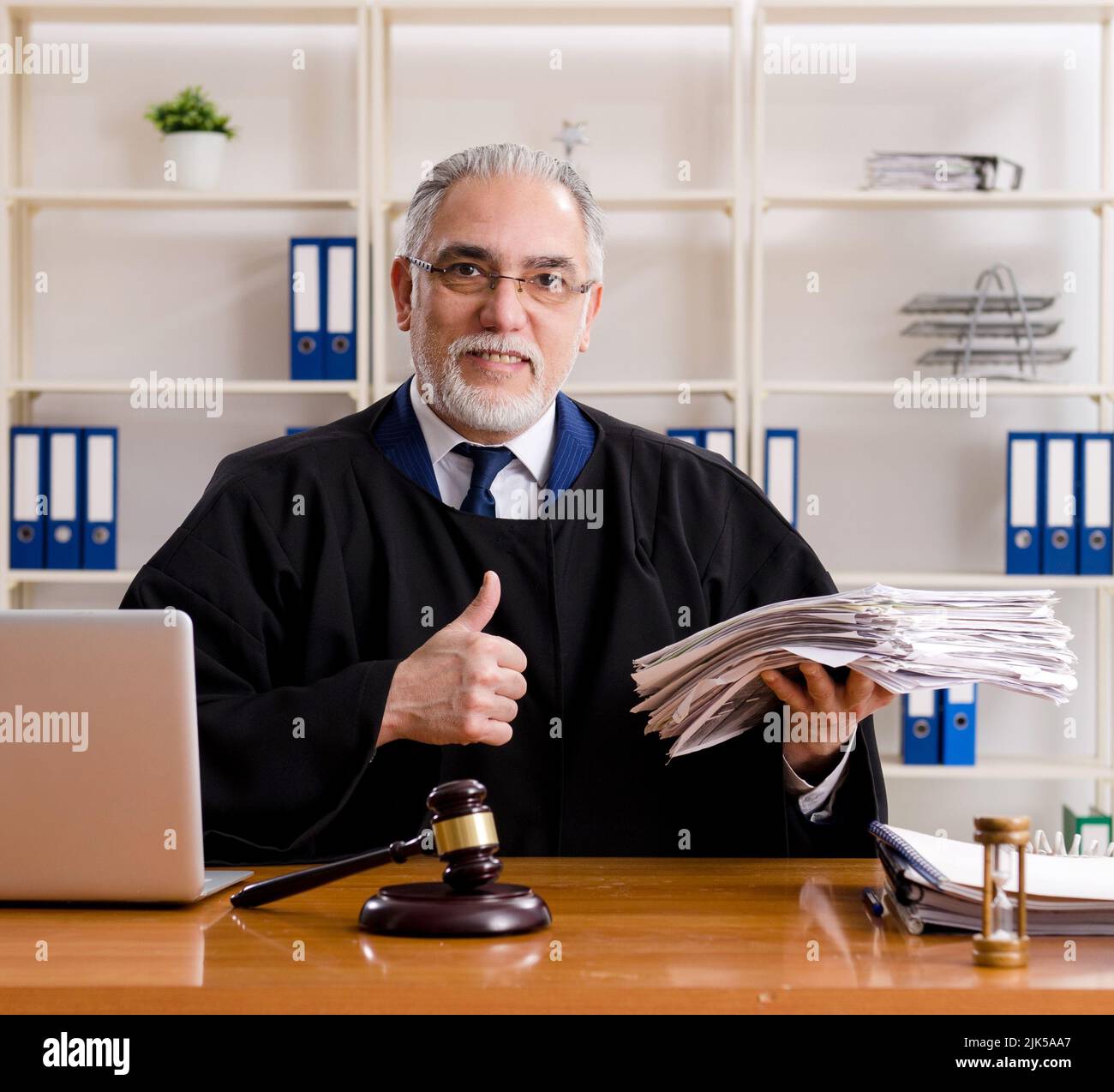 The aged lawyer working in the courthouse Stock Photo - Alamy
