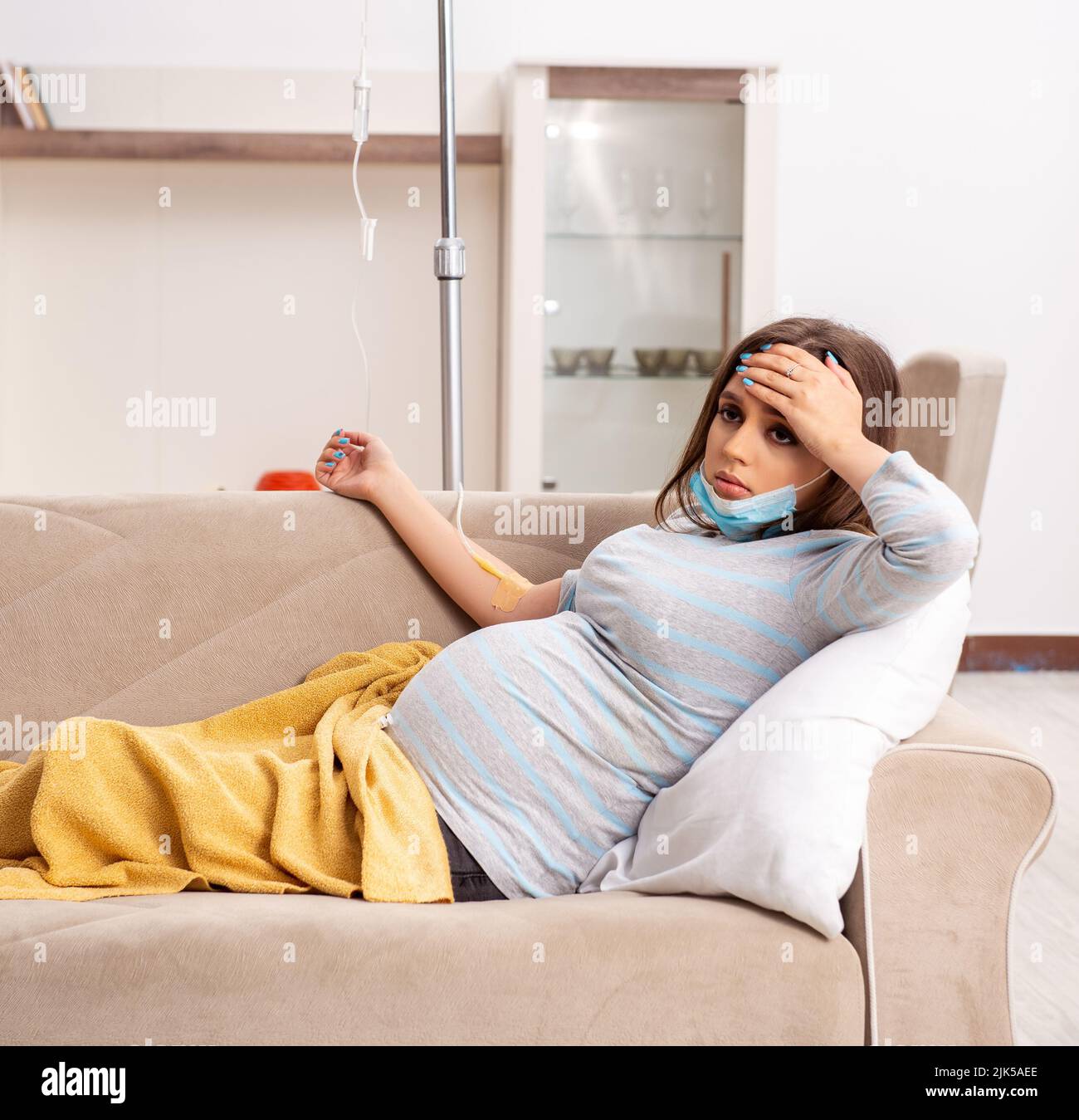 The sick pregnant woman suffering at home Stock Photo - Alamy