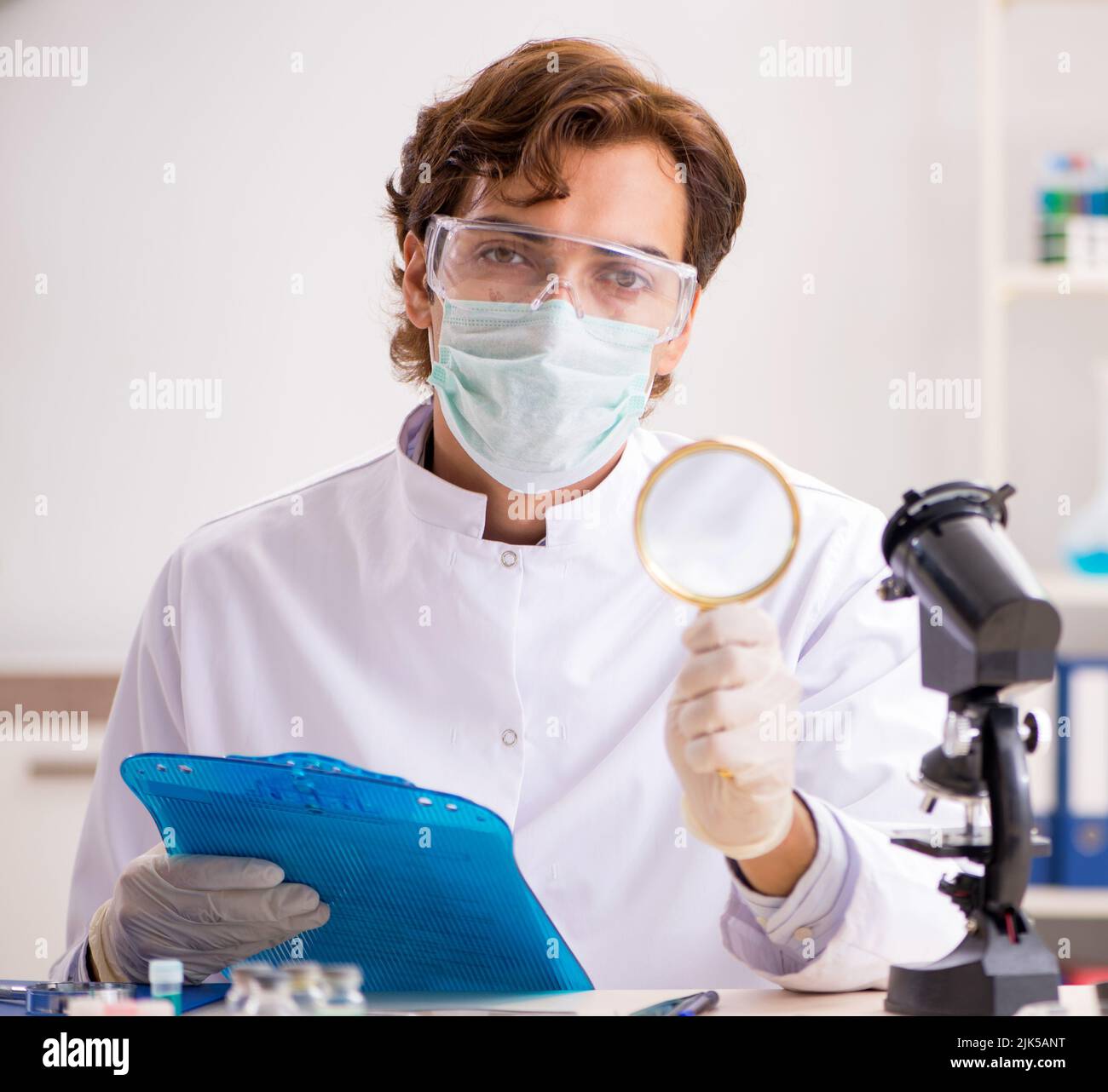 The male entomologist working in the lab on new species Stock Photo - Alamy