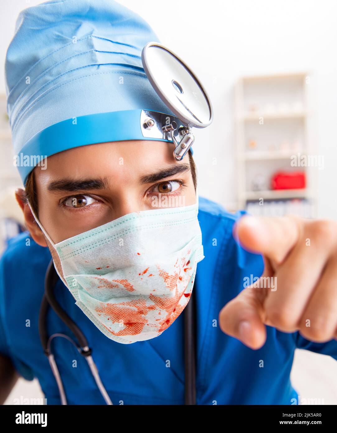 The mad doctor working in the clinic Stock Photo - Alamy