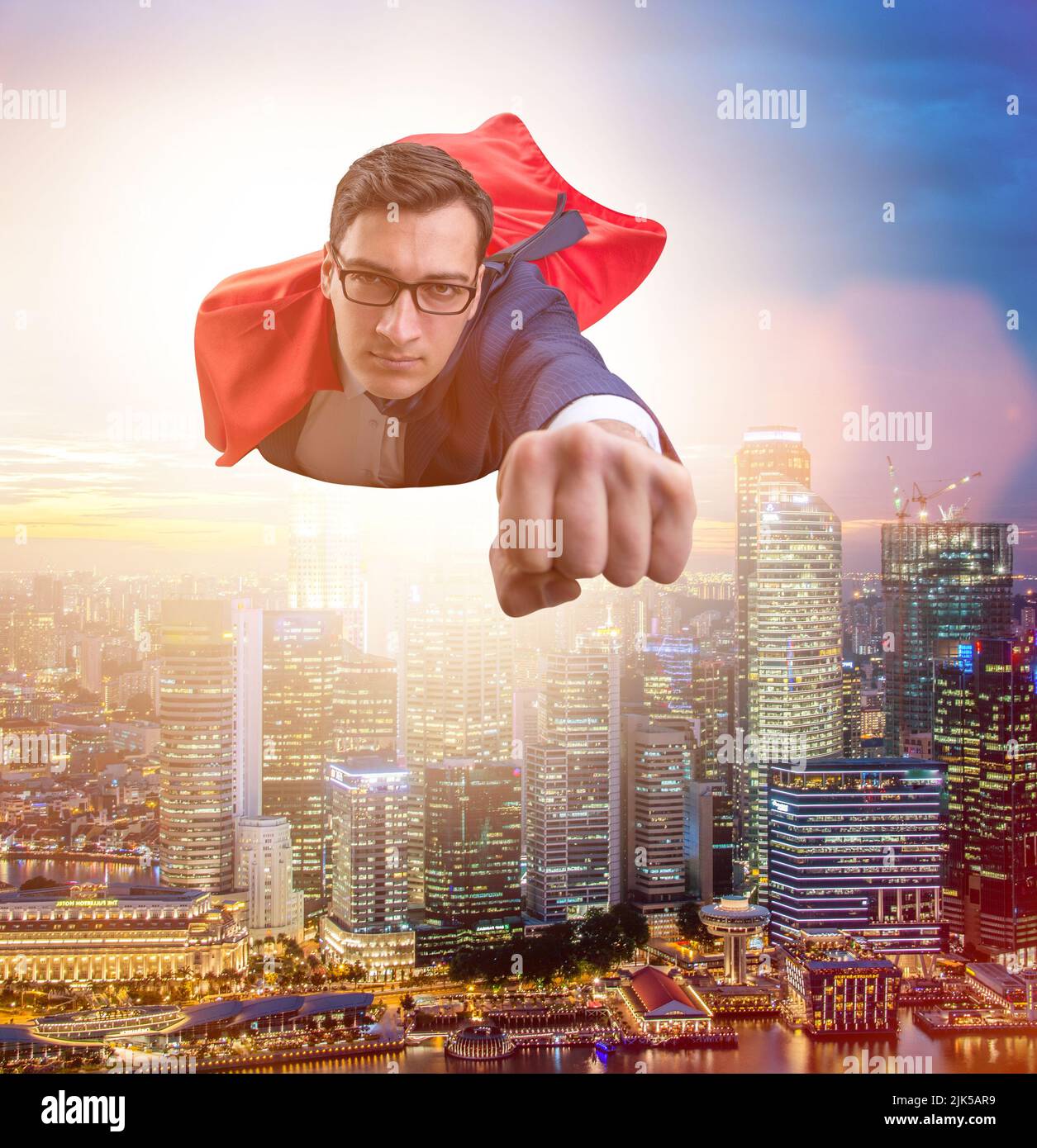 Superhero businessman flying over the city Stock Photo - Alamy