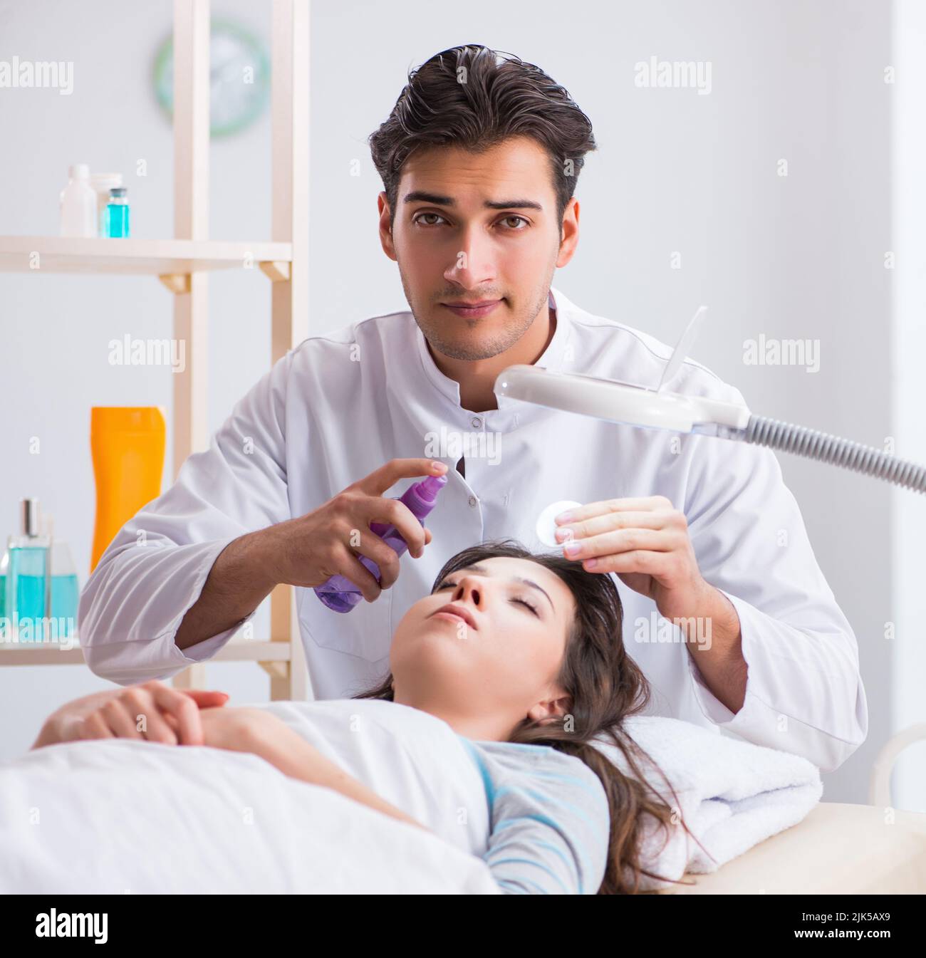 The young woman visiting male doctor cosmetologist Stock Photo - Alamy