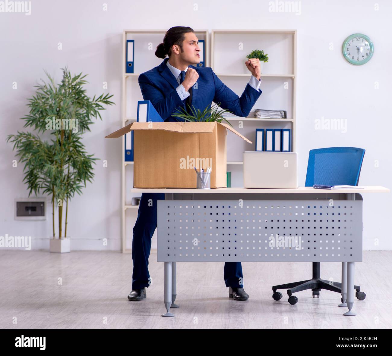 The young employee being made redundant Stock Photo - Alamy