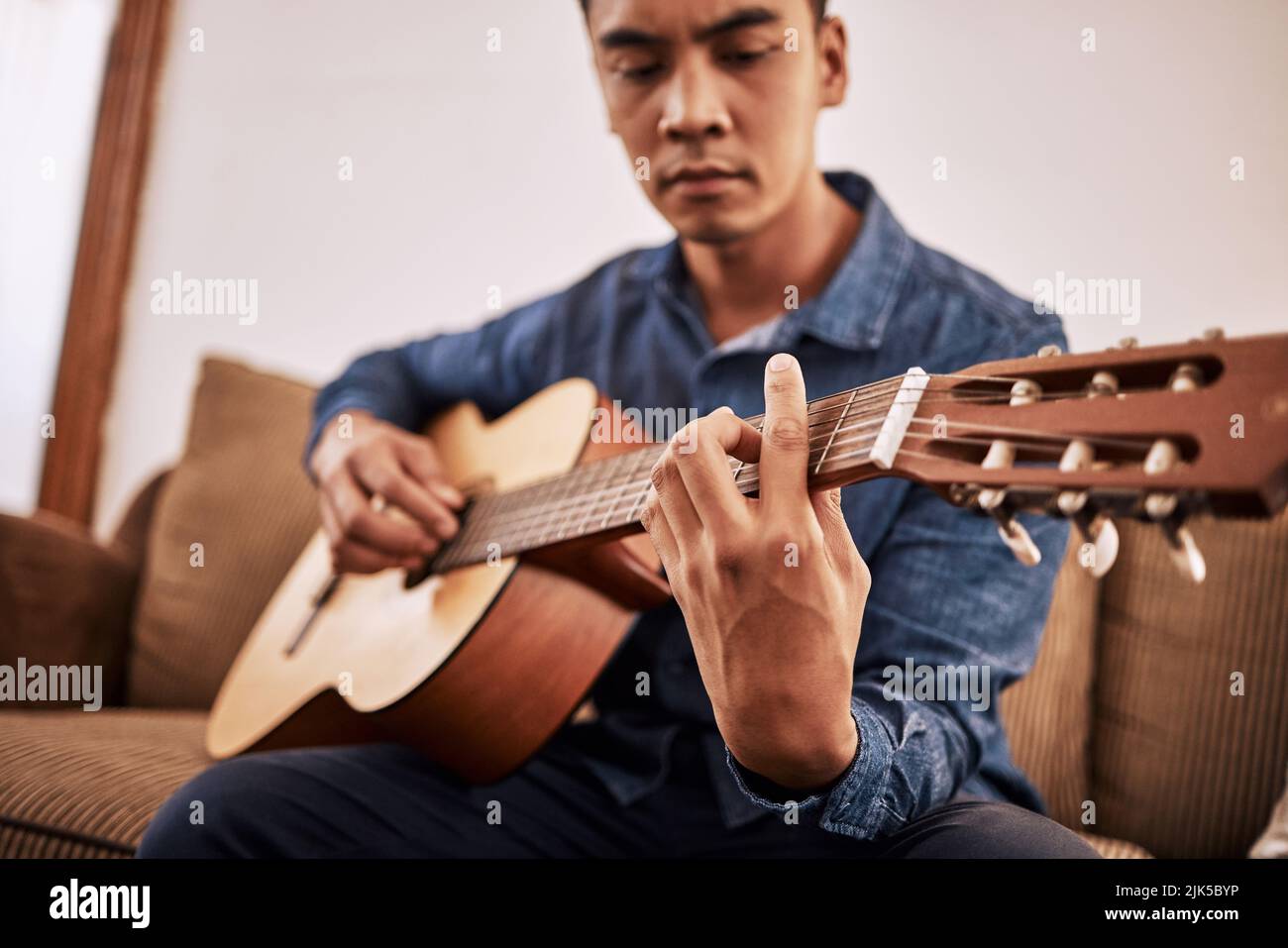 I think im finally starting to improve. a man practicing his guitar ...