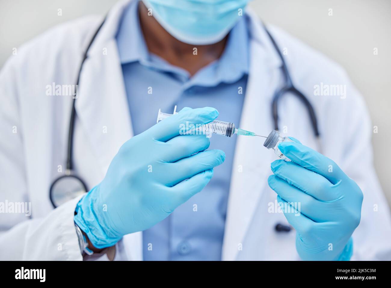 A vaccination could save a live. an unrecognizable doctor using a ...