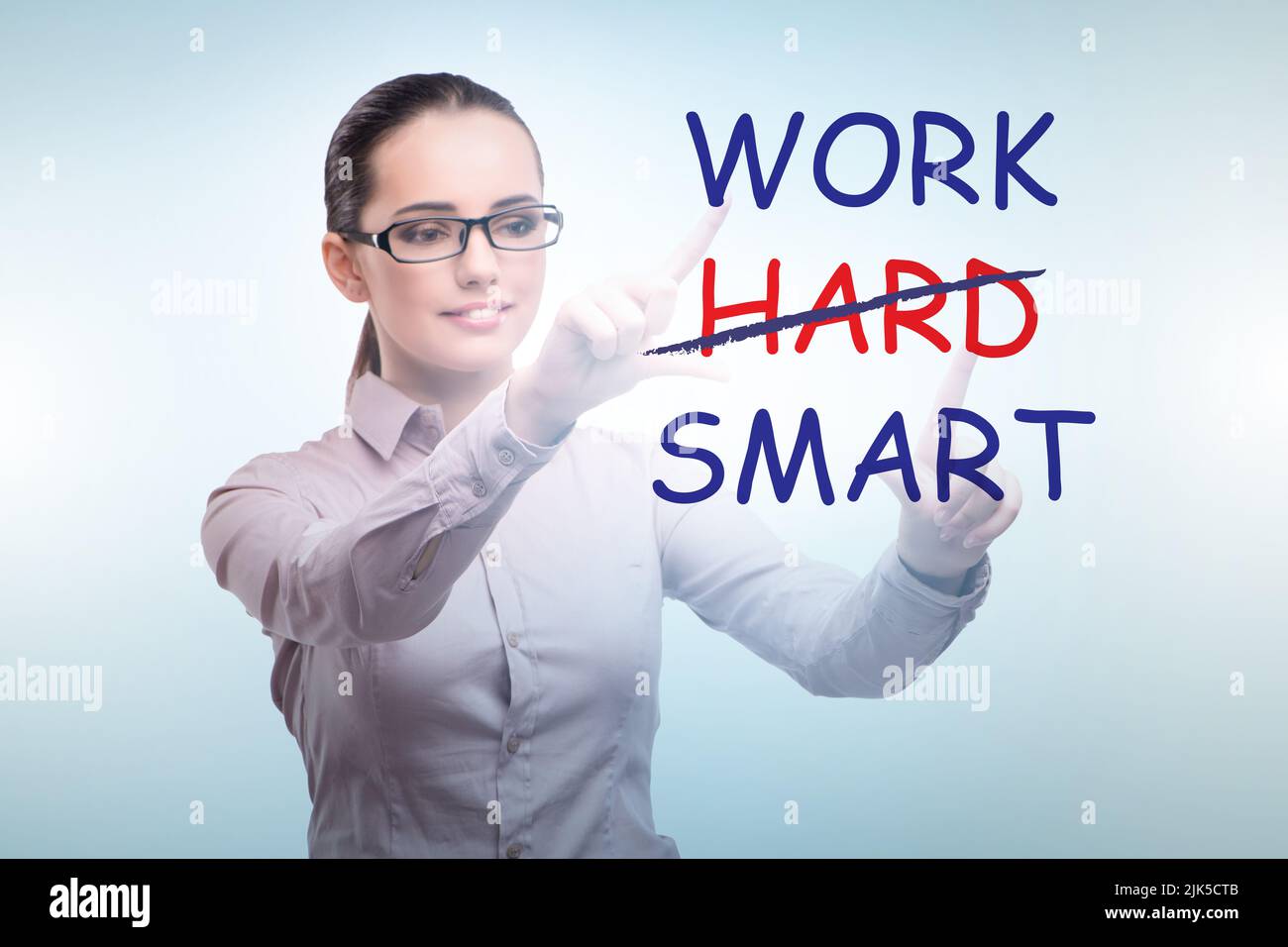 Businesswoman in the working smart not hard concept Stock Photo - Alamy