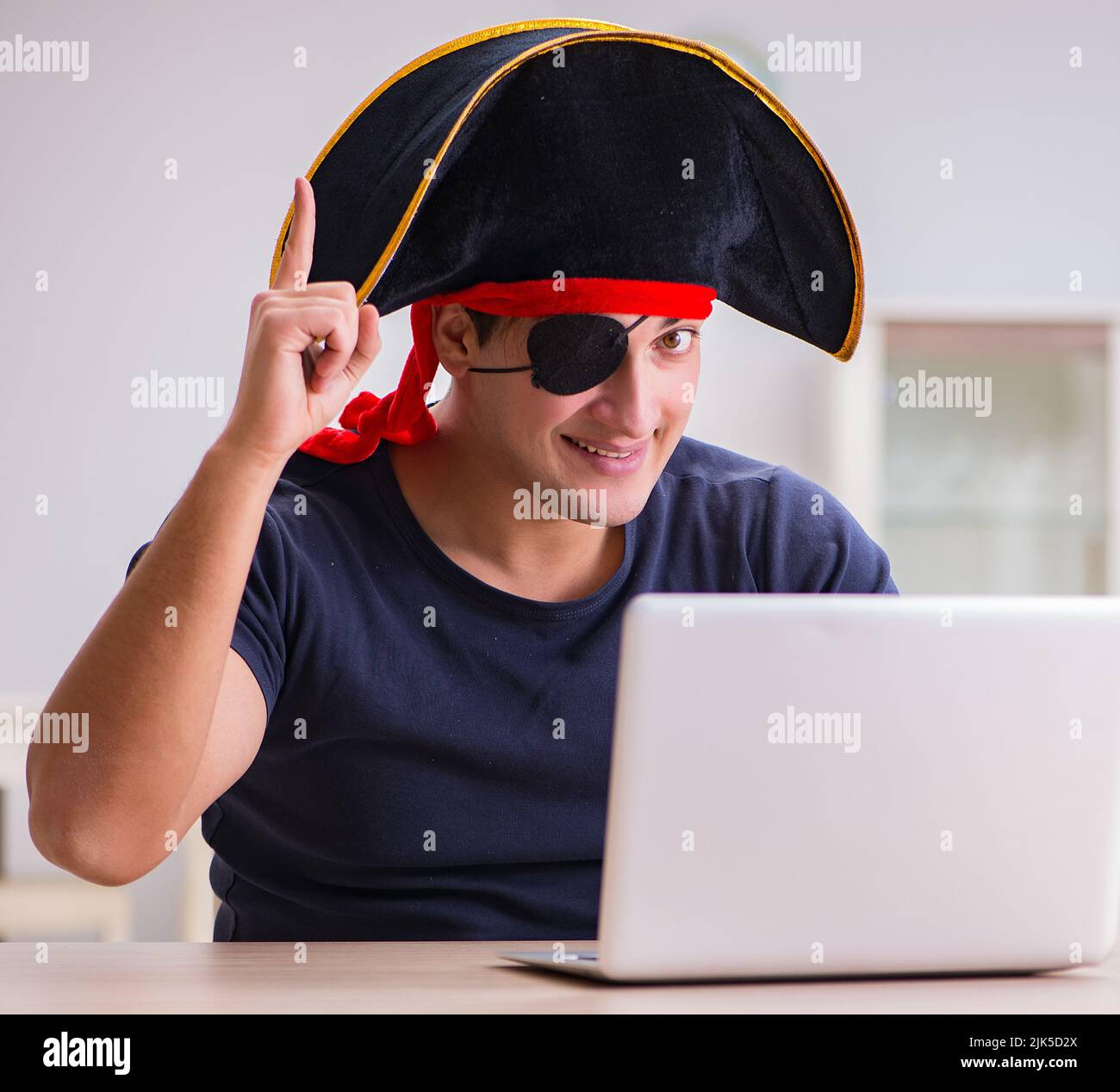 The digital security concept with pirate at computer Stock Photo - Alamy