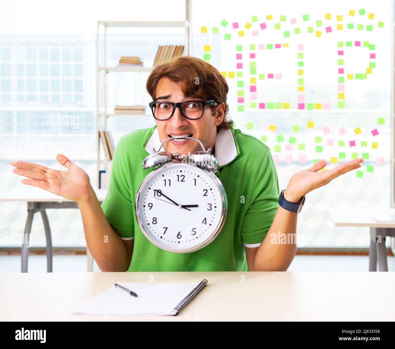 Student struggling at the exam in classroom Stock Photo - Alamy