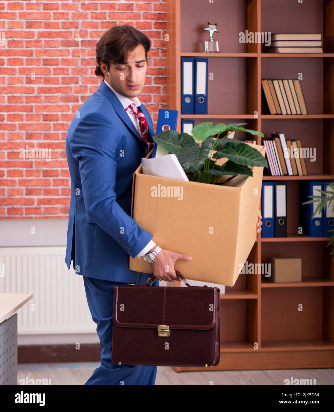 Young person being fired from his work Stock Photo - Alamy