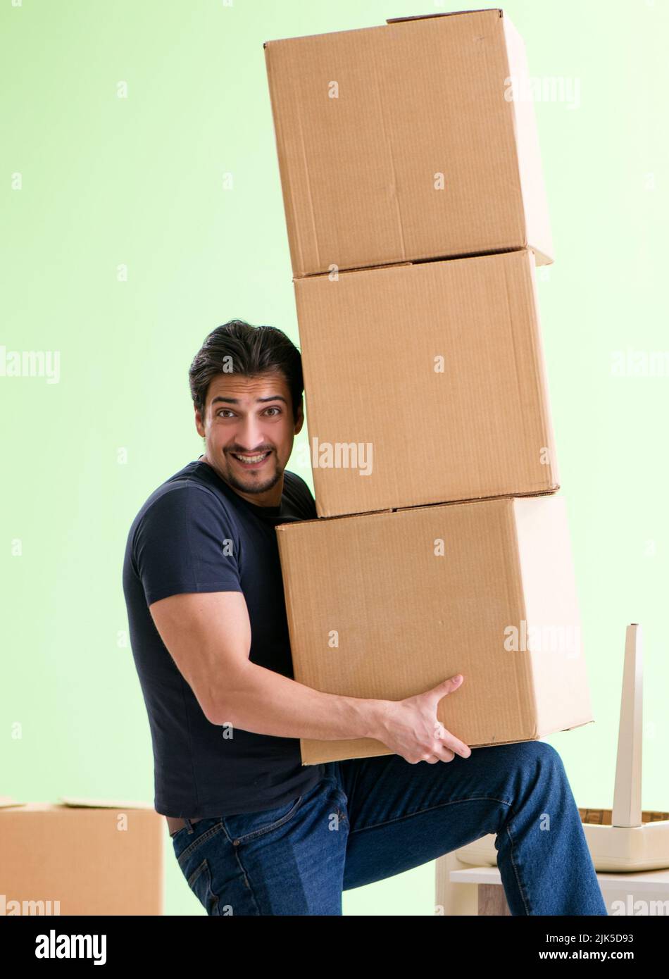 Delivery man falling stack boxes hi-res stock photography and images ...