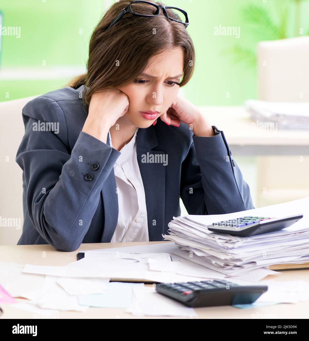 The female financial manager working in the office Stock Photo - Alamy