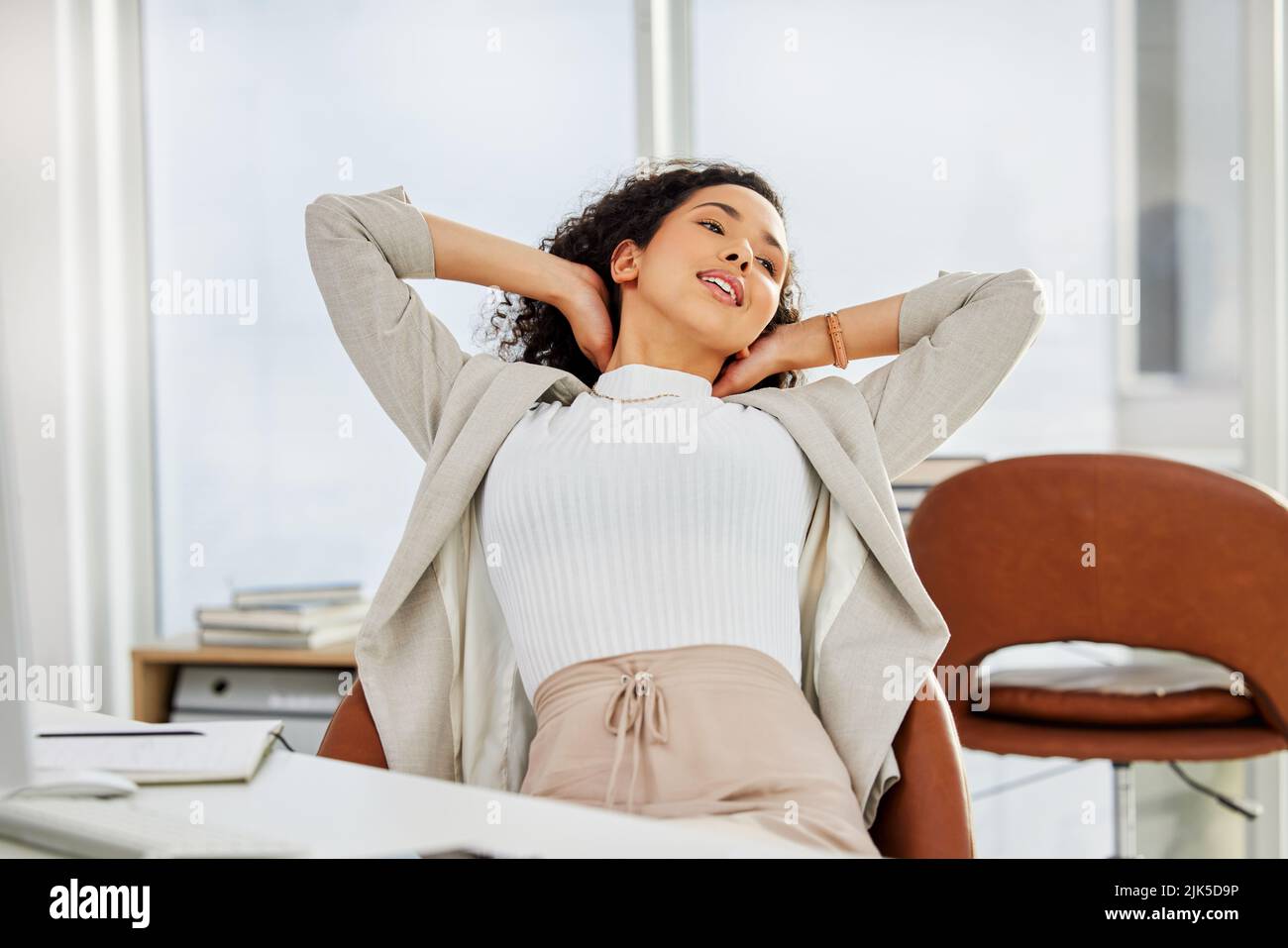 Its been a long day of completing deadlines. a young businesswoman ...