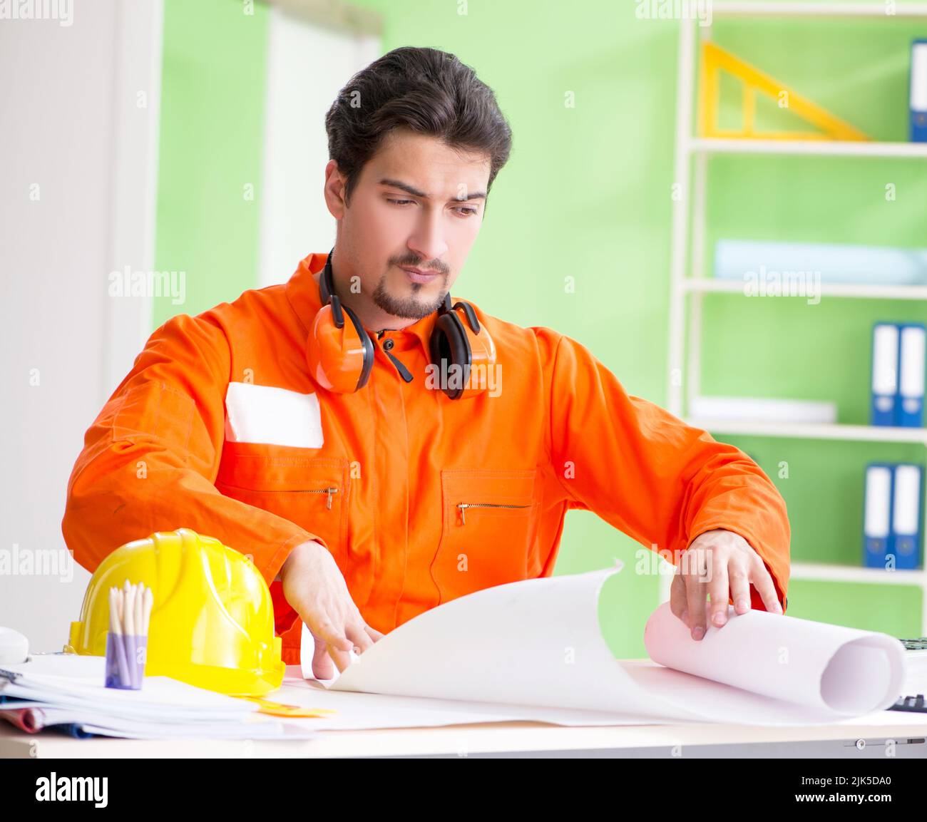 The construction supervisor planning new project in office Stock Photo ...