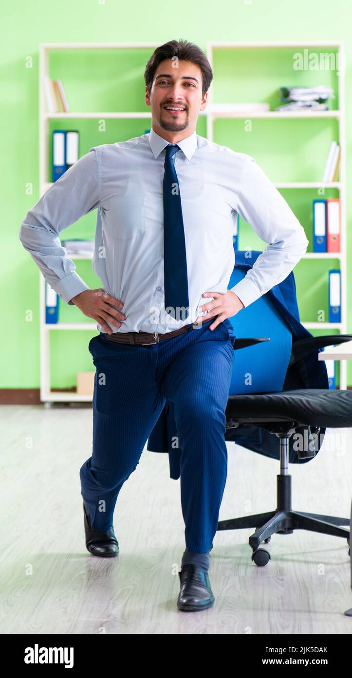 The employee doing exercises during break at work Stock Photo - Alamy