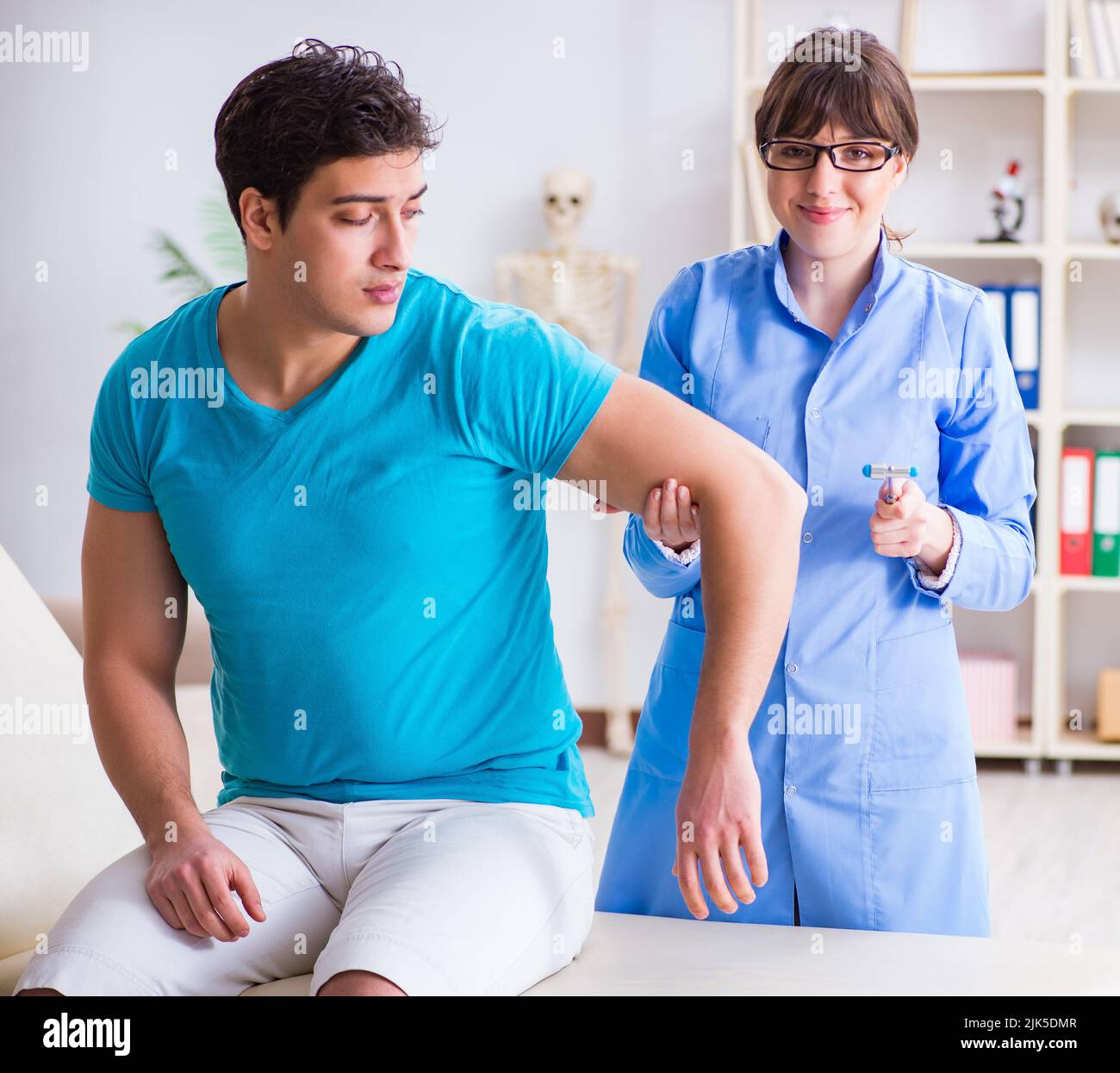 The doctor checking nerve reflexes with hammer Stock Photo - Alamy
