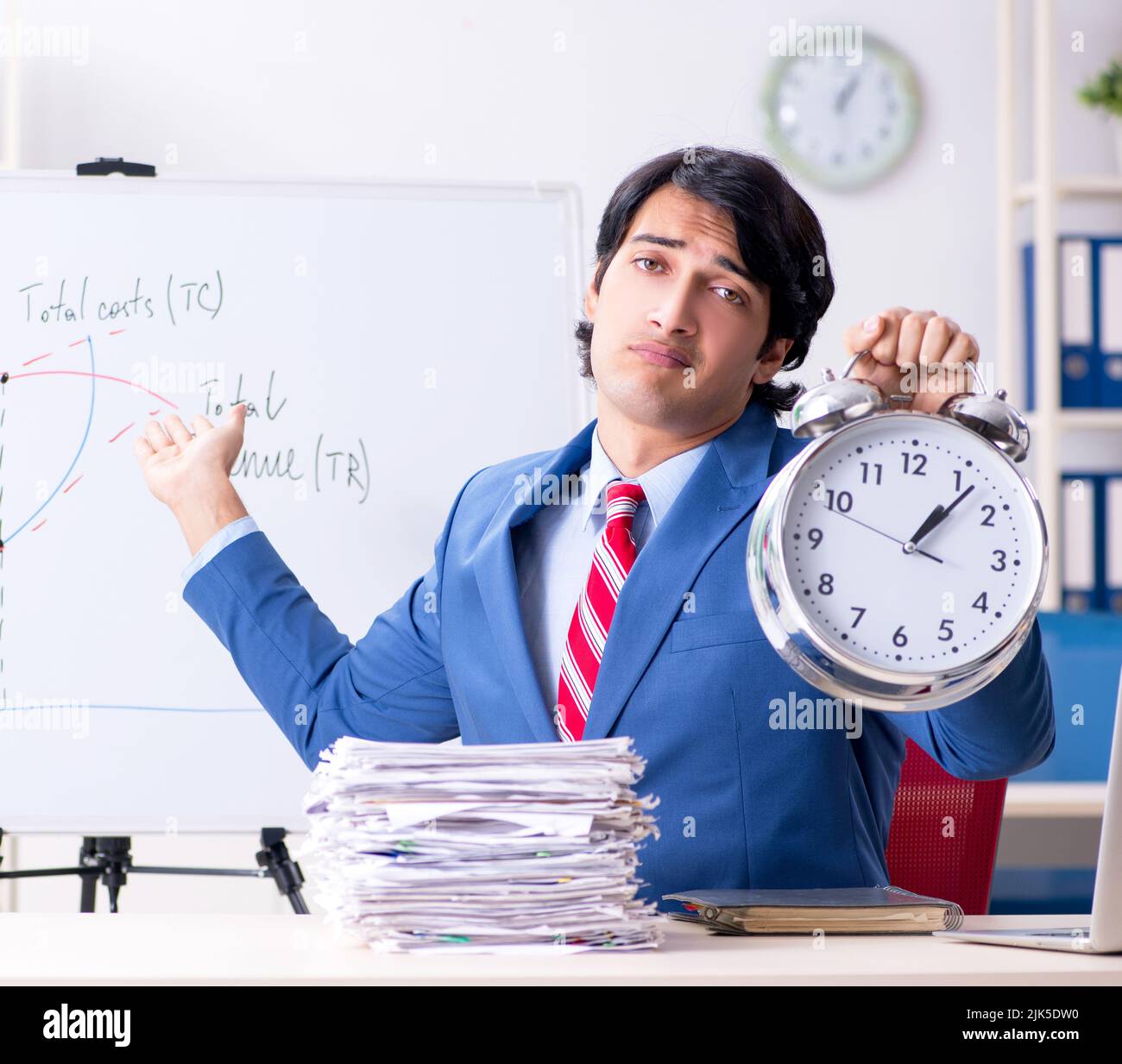 Busy businessman explaining business charts Stock Photo - Alamy
