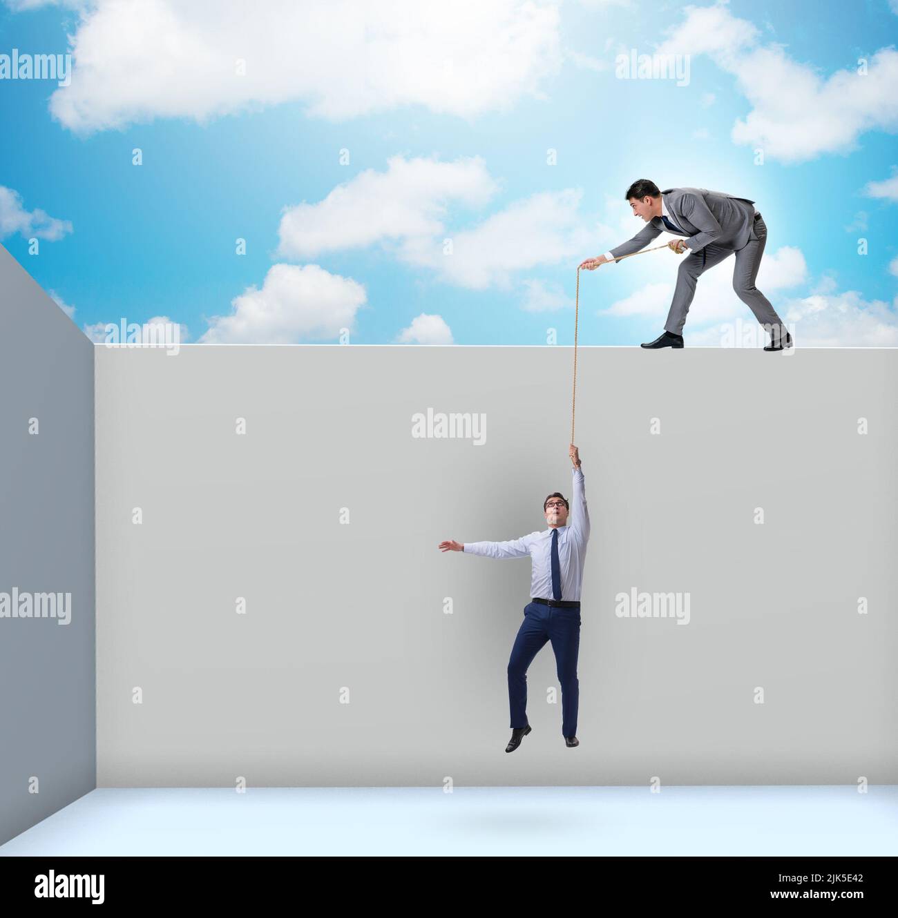 The businessman helping colleague to escape from problems Stock Photo ...