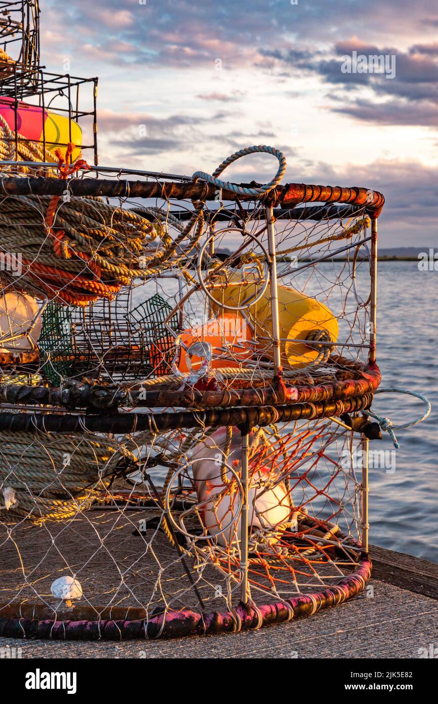 Crab cages on the Everett Marina dock. In background, sunsets over ...