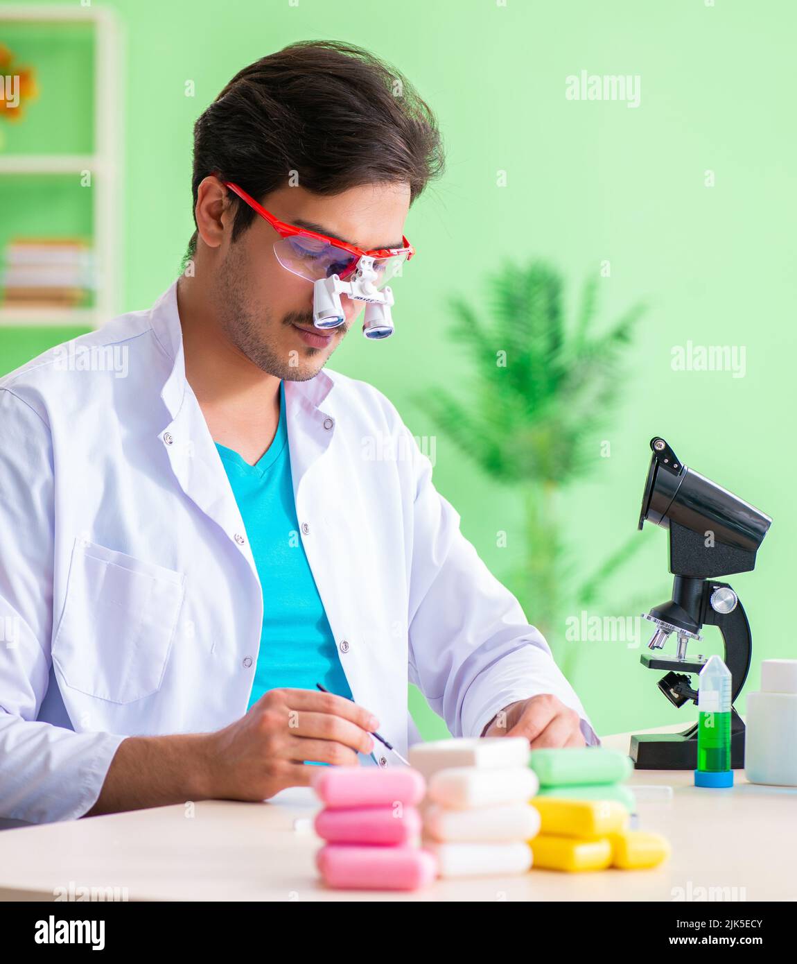 Chemist testing soap in hi-res stock photography and images - Alamy