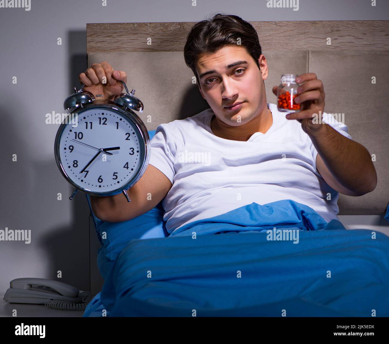 The man having trouble sleeping in bed Stock Photo - Alamy