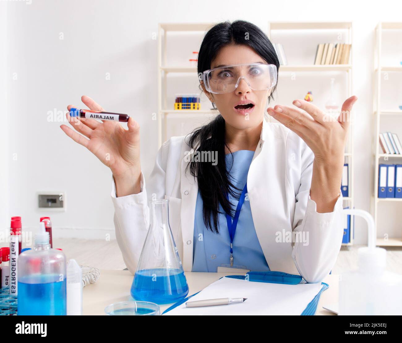 Female chemist working at the lab Stock Photo - Alamy