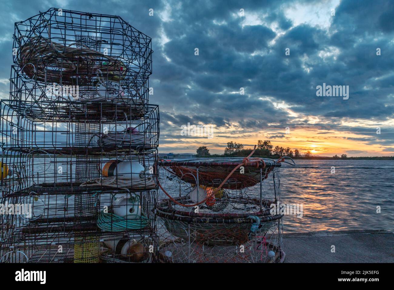 Crab cages on the Everett Marina dock. In background, sunsets over ...