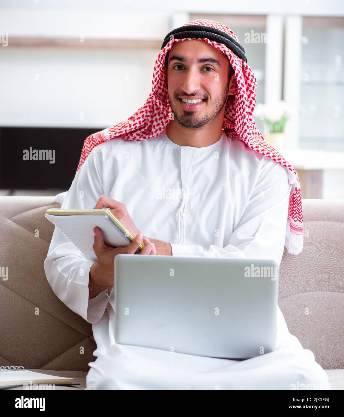 The arab man working at home on his work Stock Photo - Alamy
