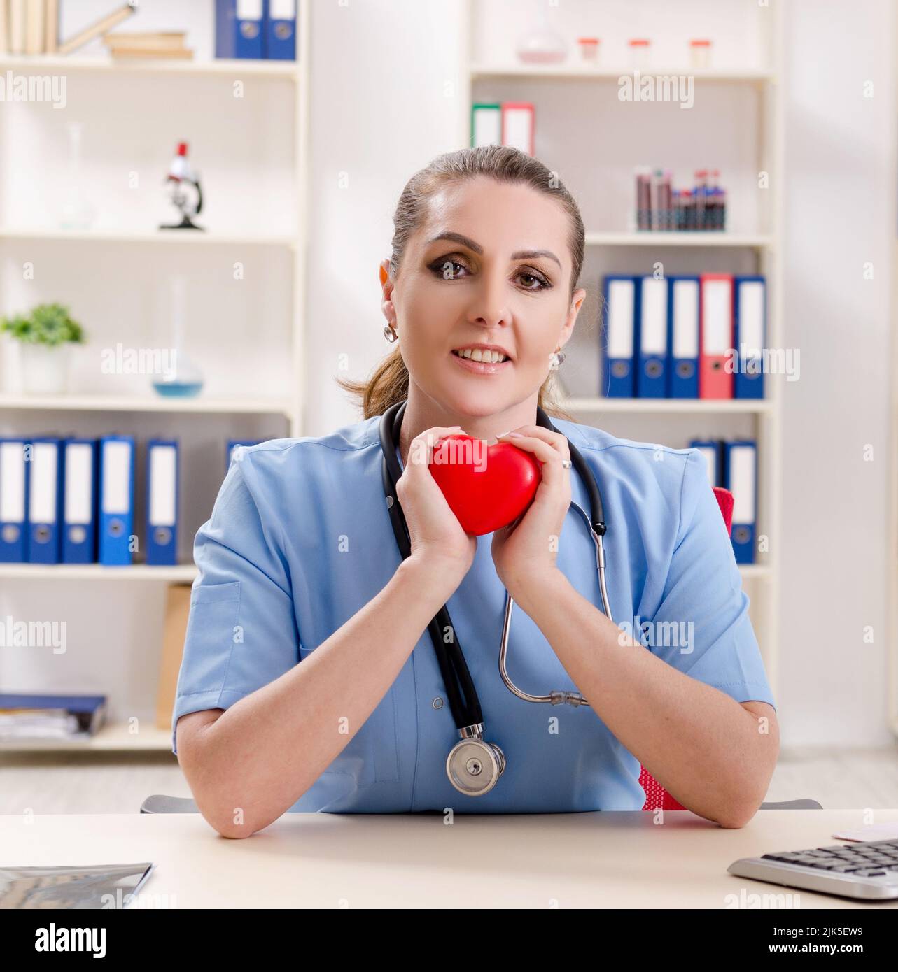 Female doctor cardiologist working in the clinic Stock Photo - Alamy
