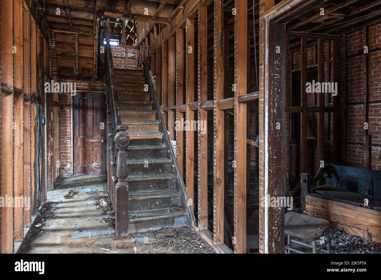 ornate stair railing in abandoned and stripped old farm house Stock ...