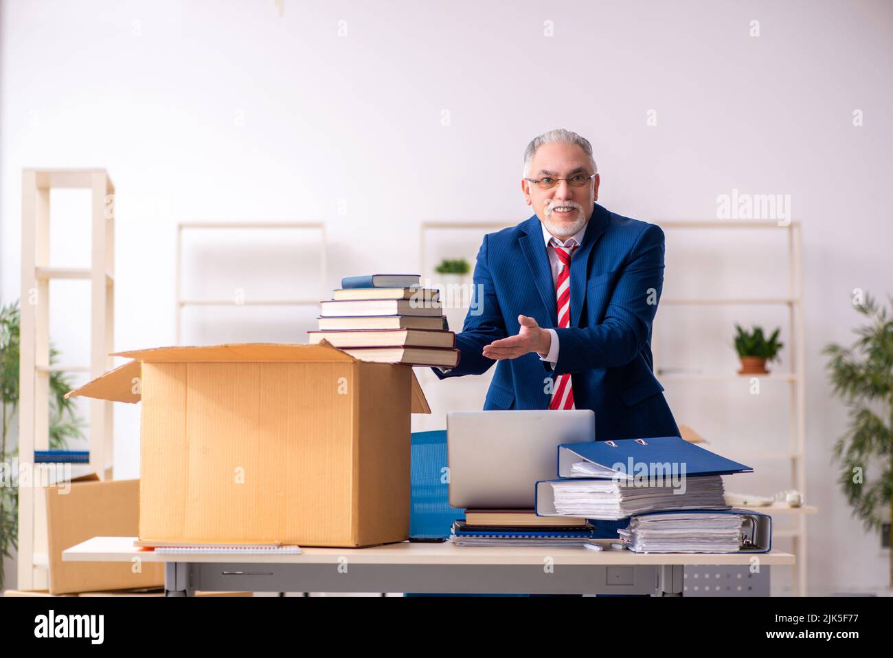 Old businessman employee in movement concept Stock Photo - Alamy