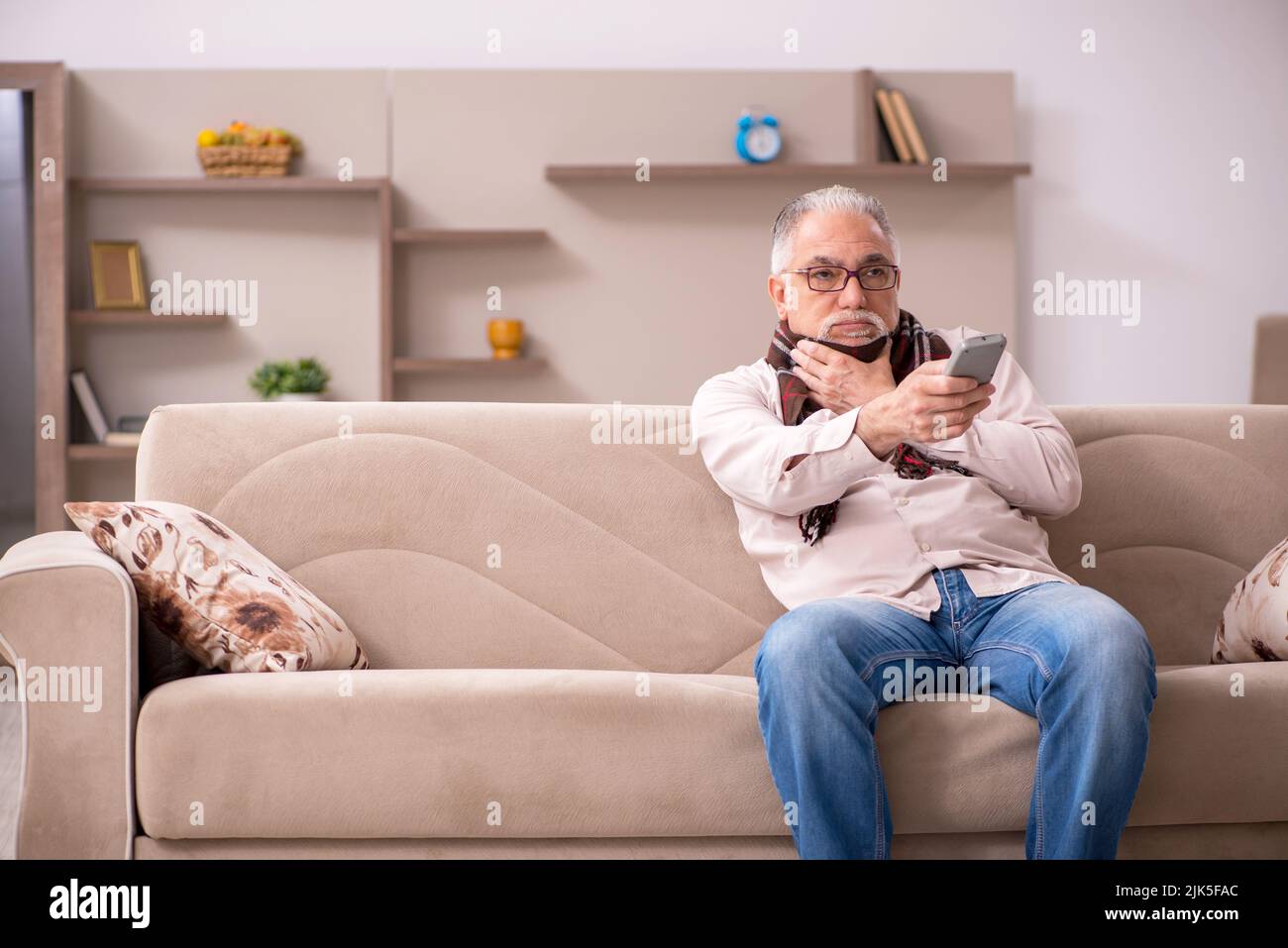 Old man pensioner suffering at home Stock Photo - Alamy