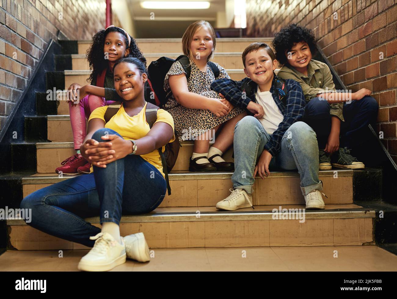 Friends make school fun. Full length shot of a diverse group of ...
