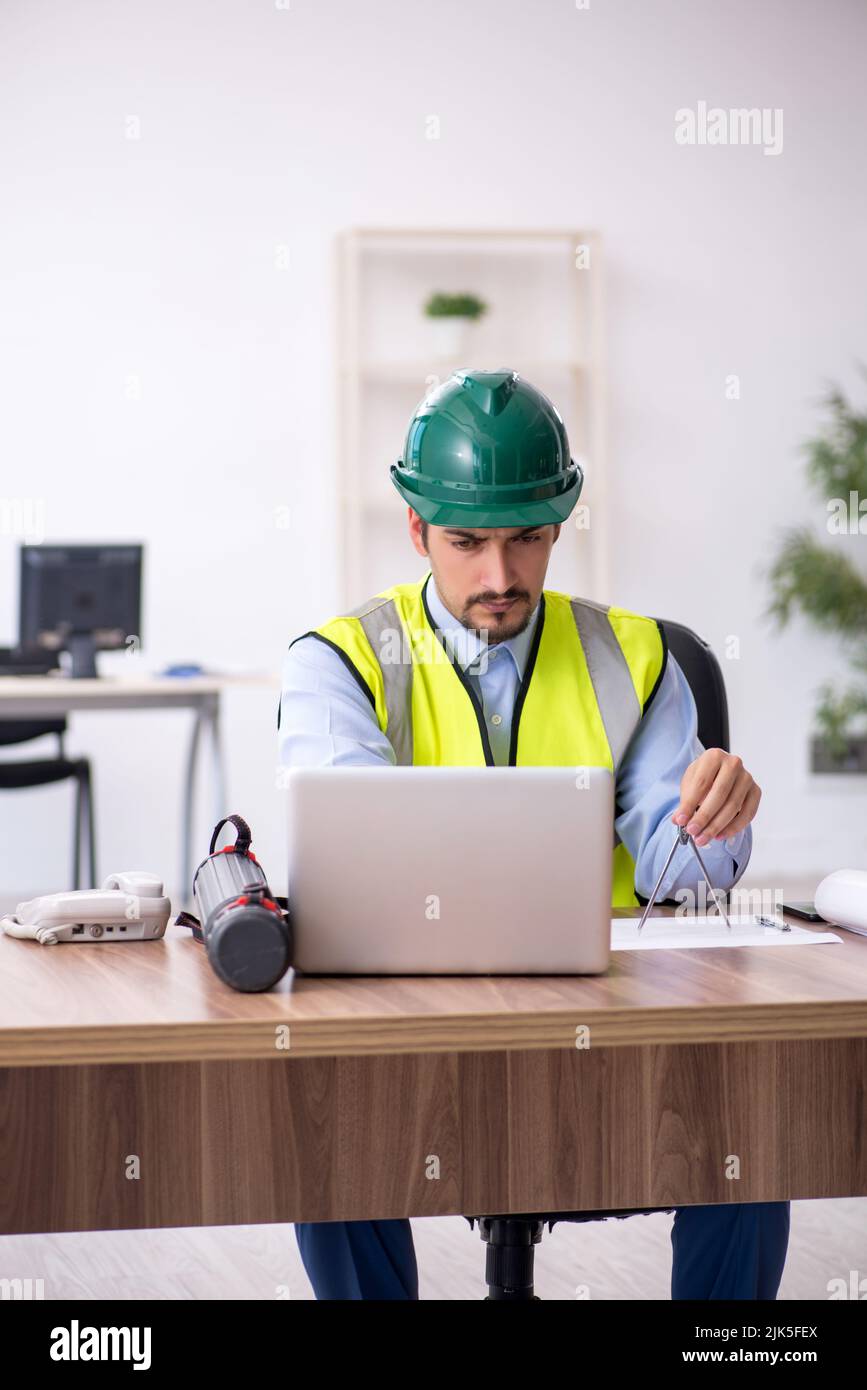 Young architect working in the office Stock Photo - Alamy