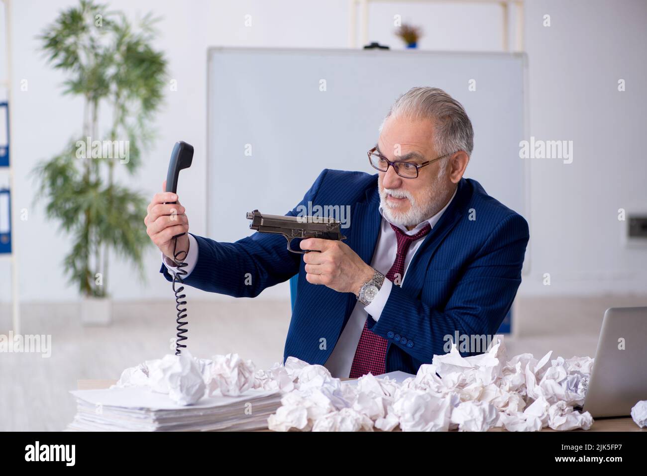 Old businessman employee in brainstorming concept Stock Photo - Alamy