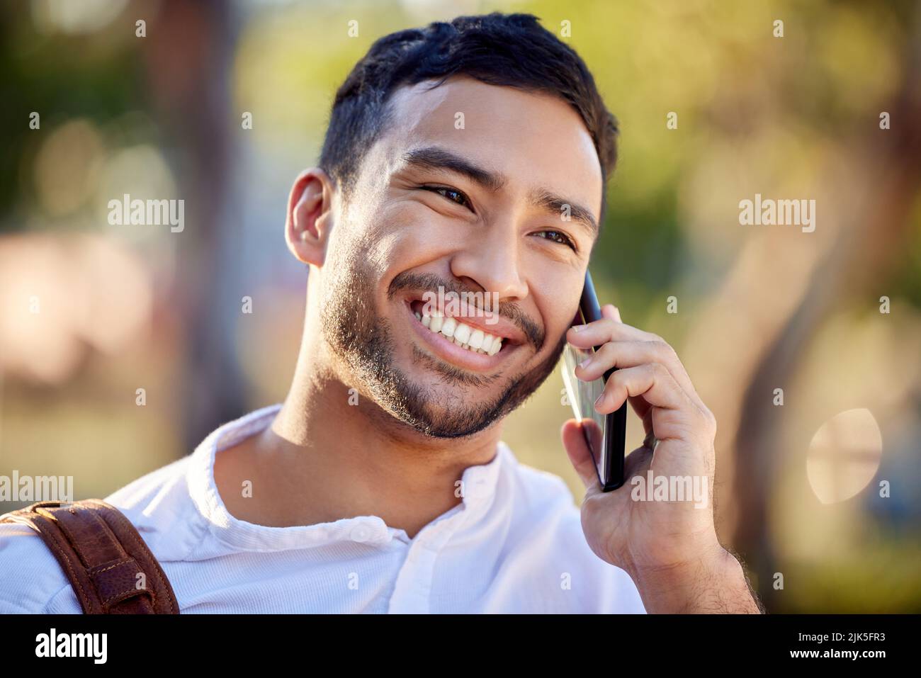 Where am I meeting you. a handsome young businessman standing alone in ...