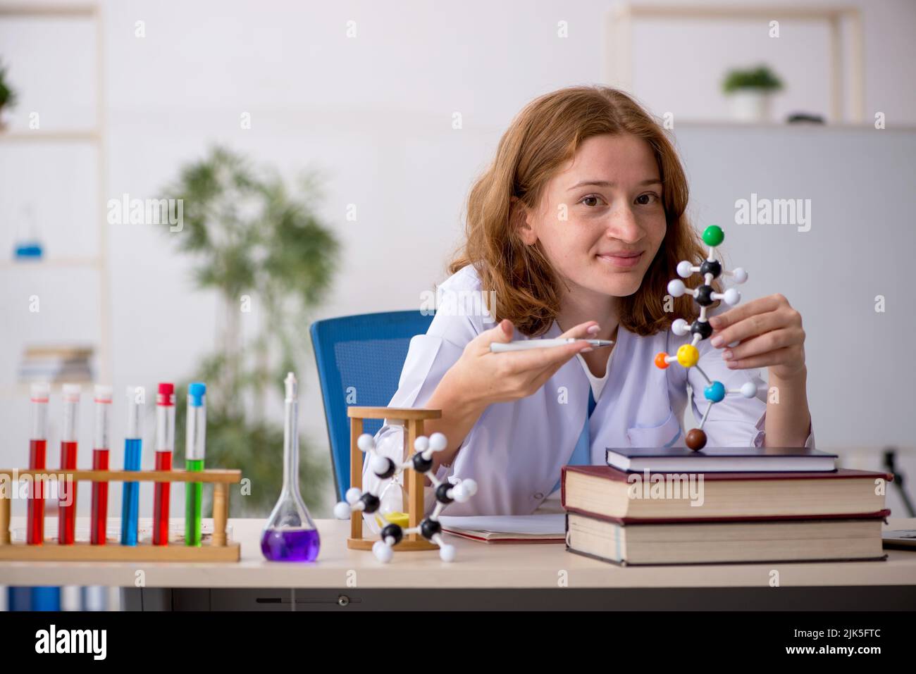 Female scientist studying molecular model hi-res stock photography and ...