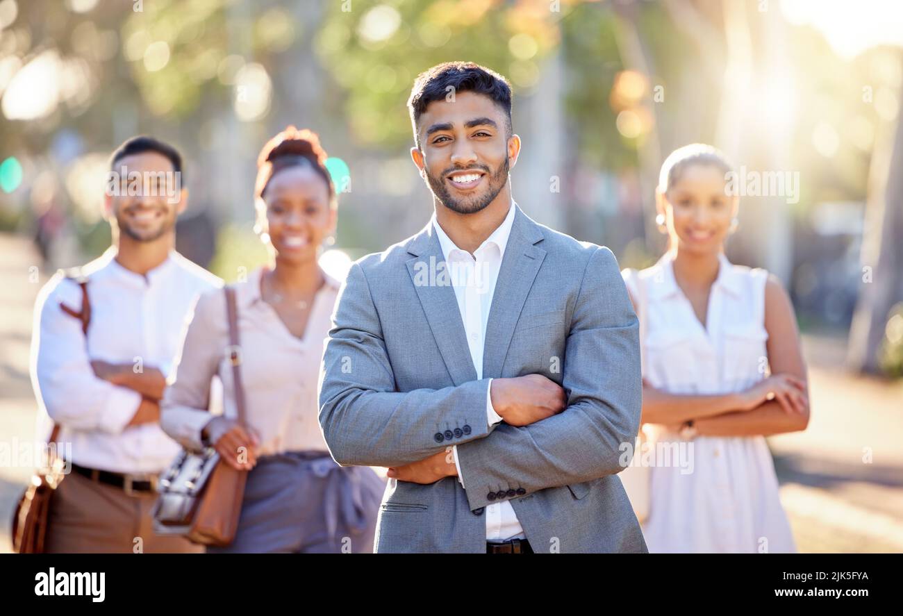 Were a team of champions. a diverse group of businesspeople standing ...